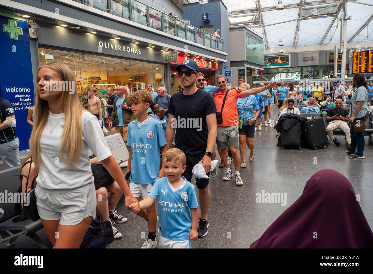 Man City Fans ariving at Picadilly Station for huge trophy parade 12 ...