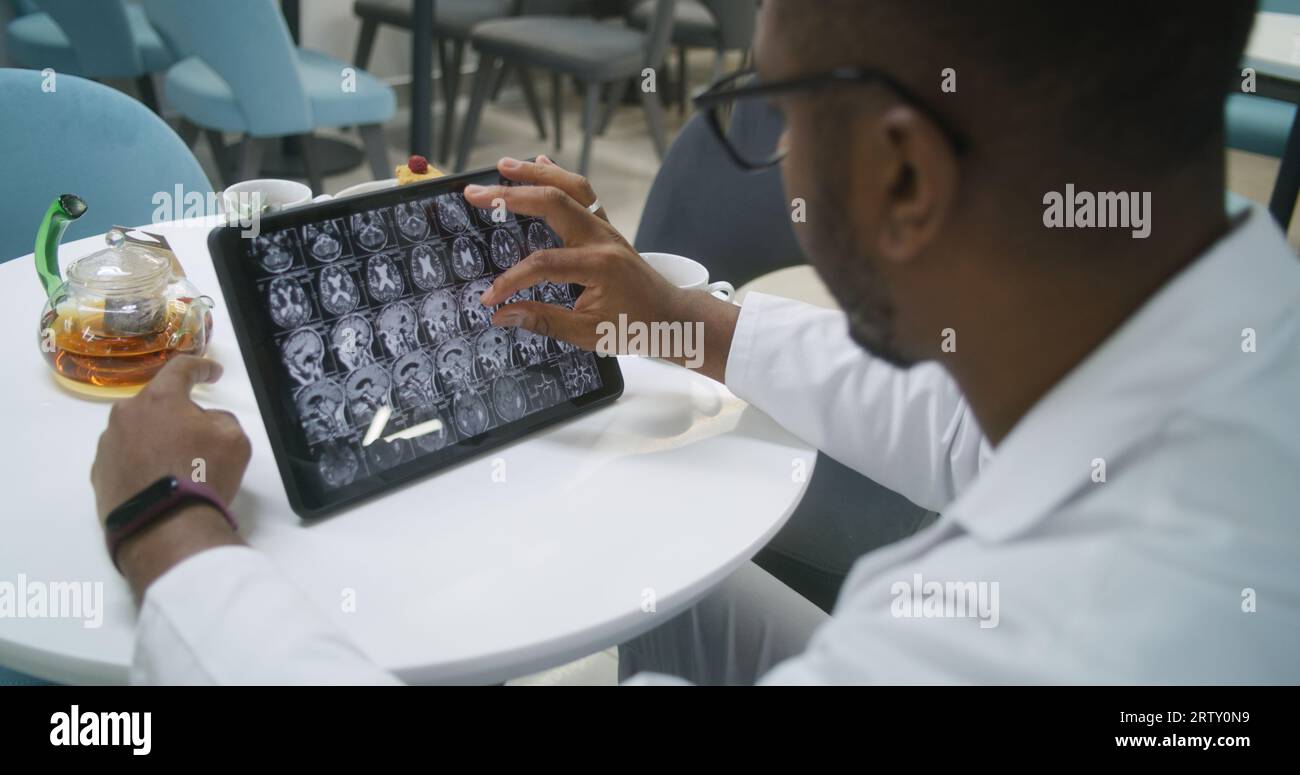 Professional doctor watches image mri hi-res stock photography and ...