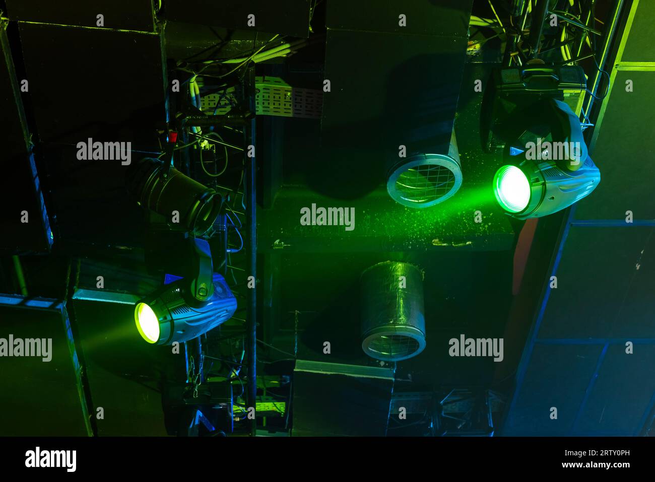 Green scenic spot lights with strong beams in smoke over dark ...