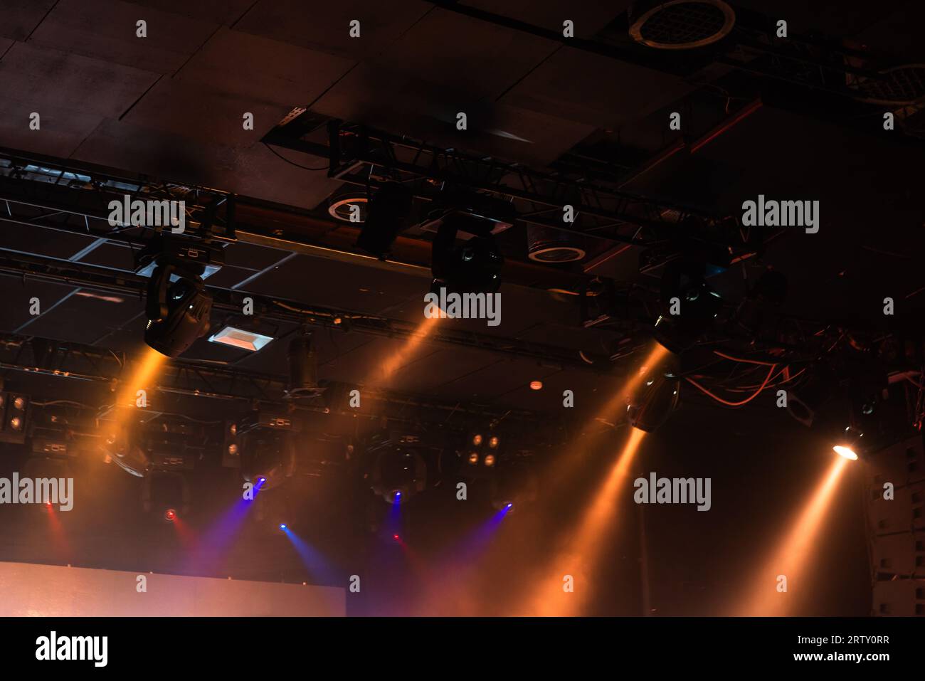 Spot lights with strong beams in smoke, modern stage illumination ...