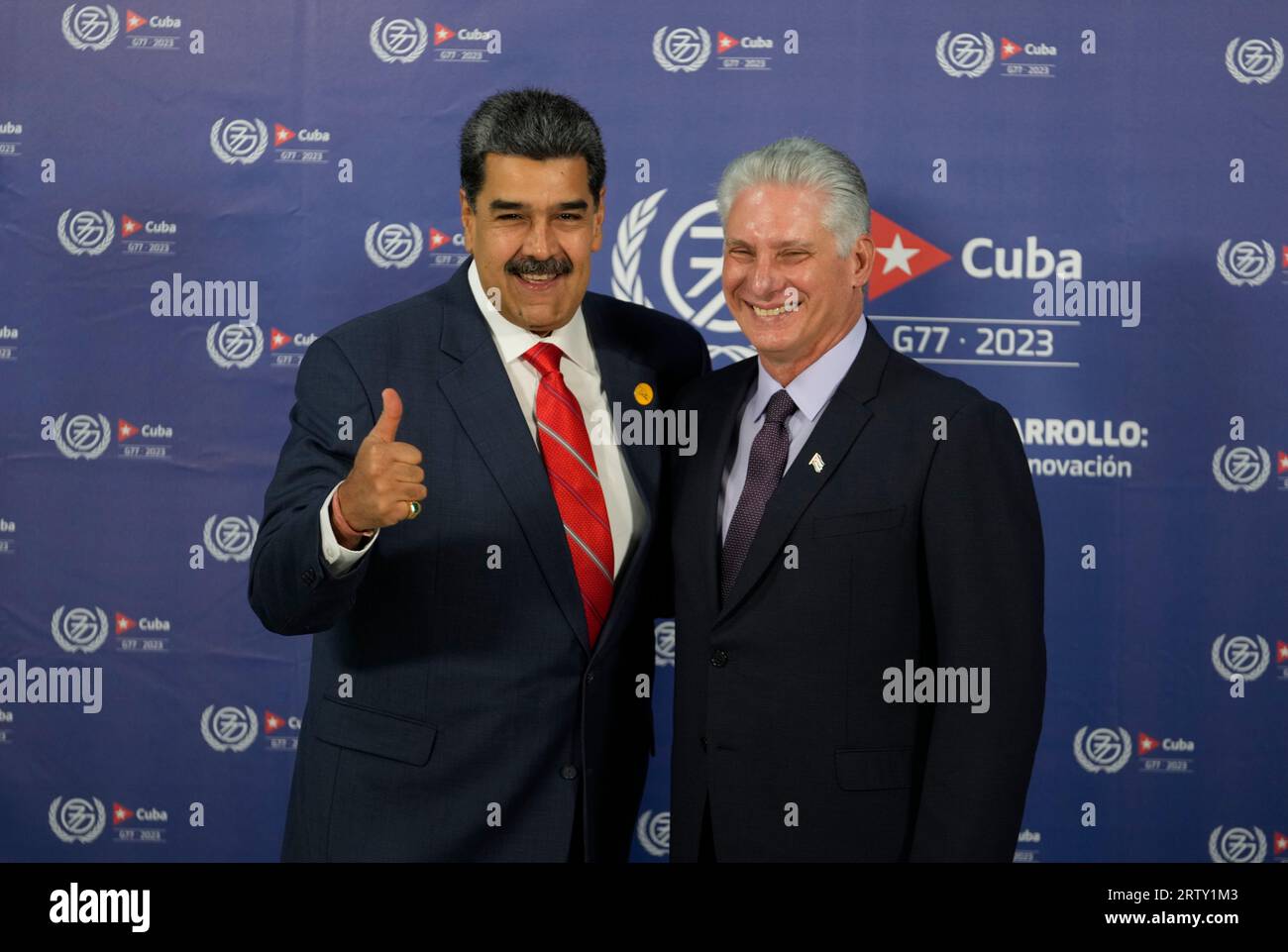Cuban President Miguel Diaz-Canel, right, poses for photos with ...