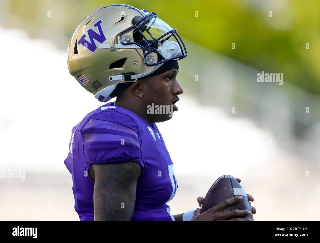 Washington quarterback Michael Penix Jr. warms up before an NCAA college football game against ...