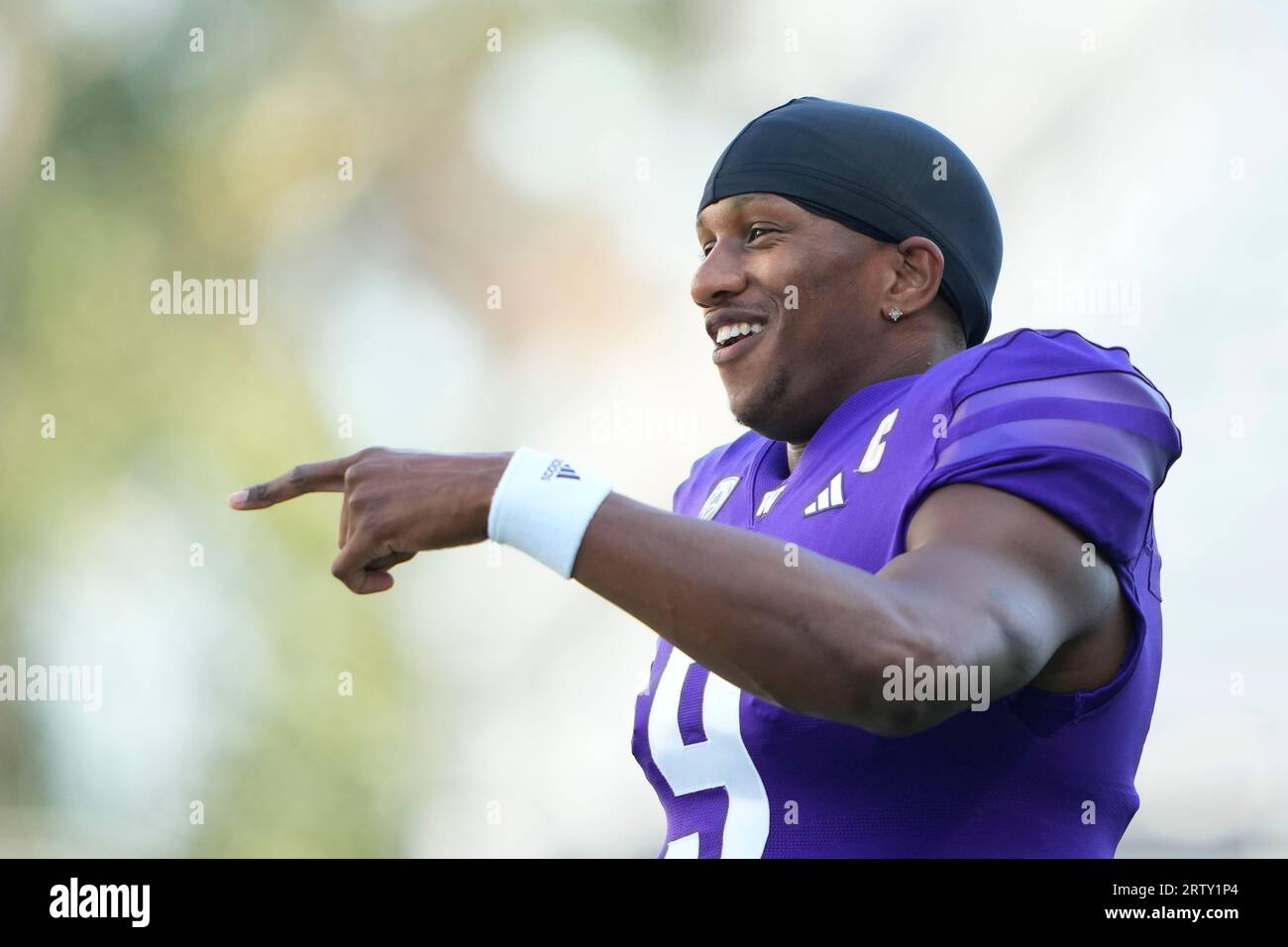 Washington quarterback Michael Penix Jr. smiles during warmups before an NCAA college football ...