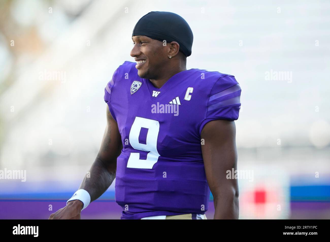 Washington quarterback Michael Penix Jr. smiles during warmups before an NCAA college football ...