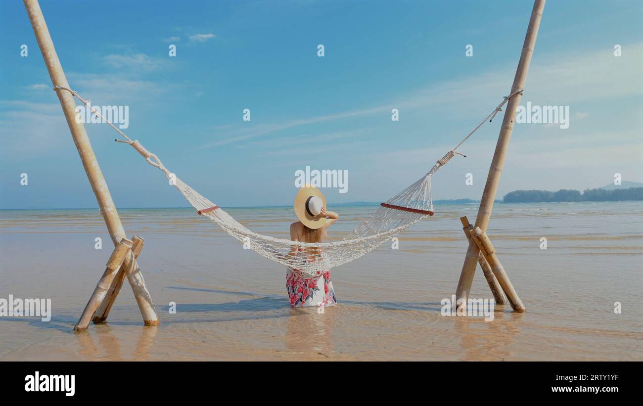 Woman hammock beach sunbathing hi-res stock photography and images - Alamy