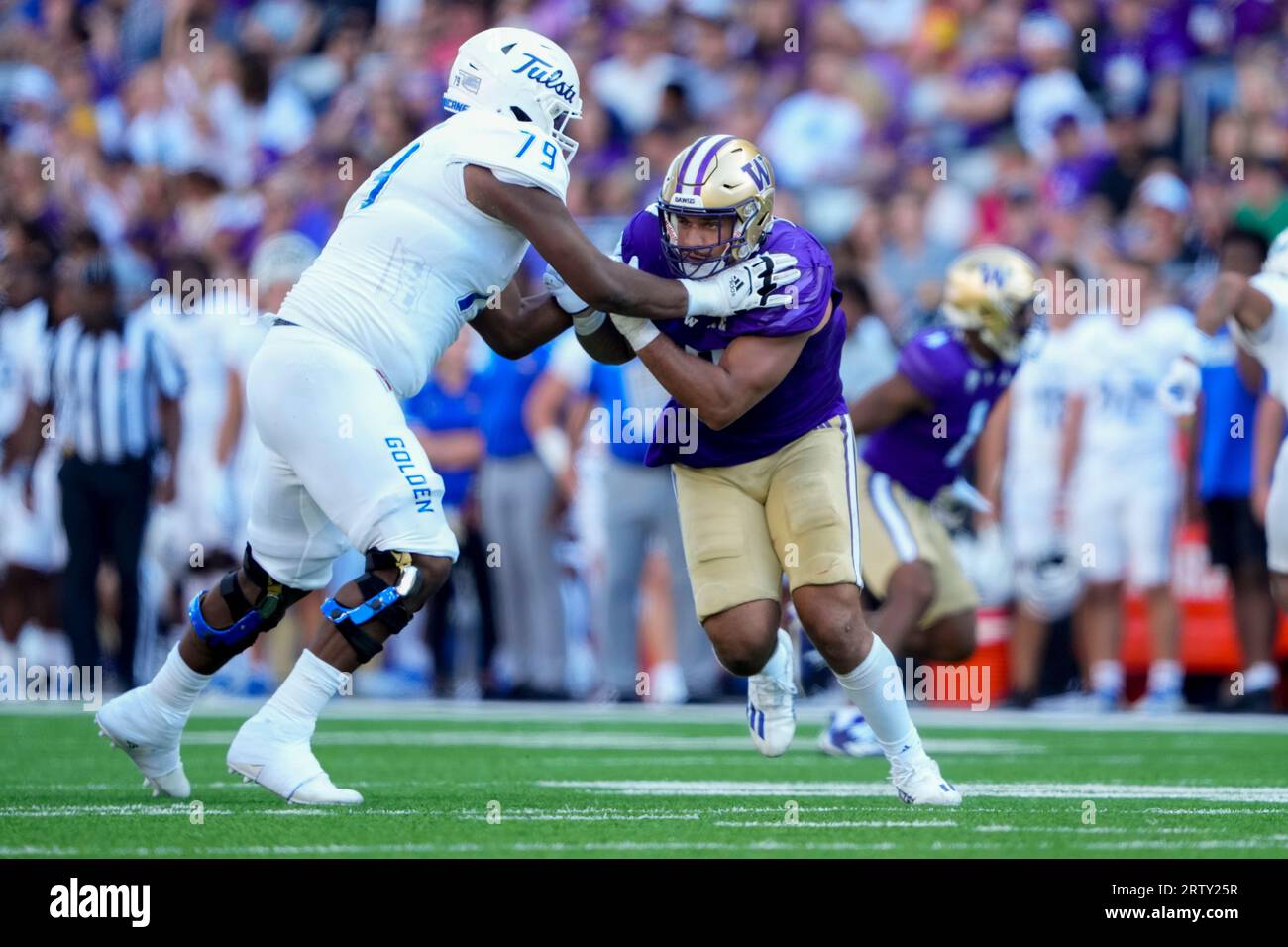 Washington edge Bralen Trice in action against Tulsa offensive lineman ...