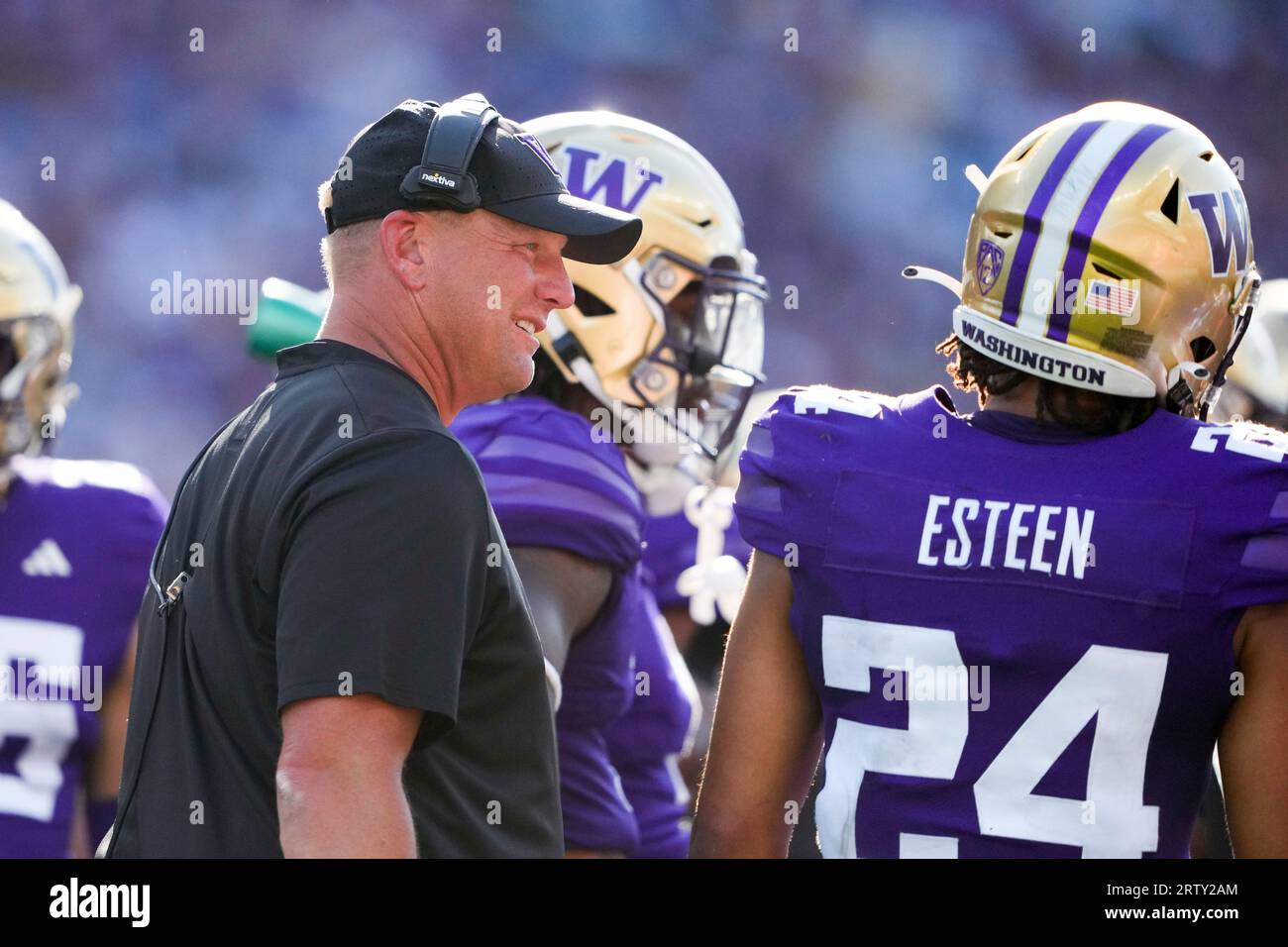 Washington head coach Kalen DeBoer talks with his team, including ...