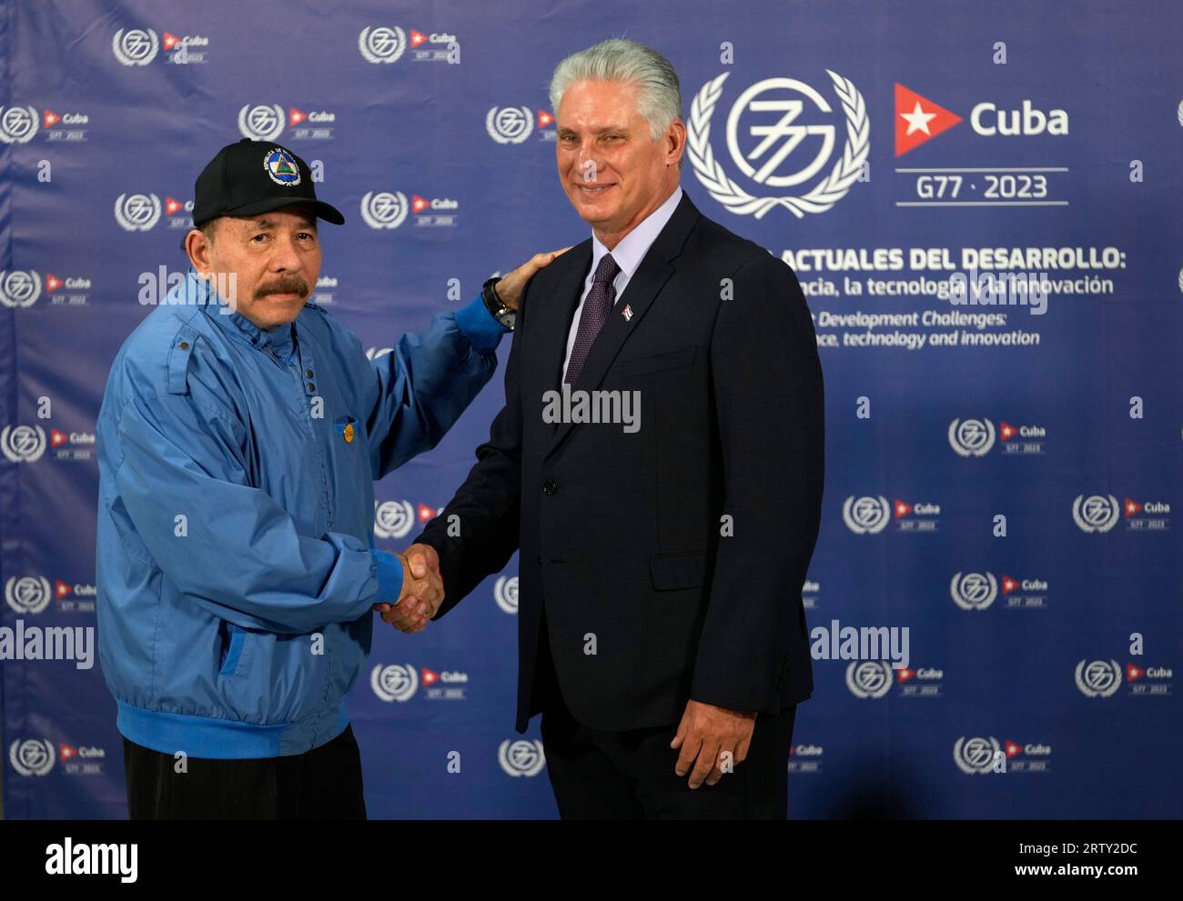 Cuban President Miguel Diaz-Canel, right, shakes hands with Nicaragua's ...