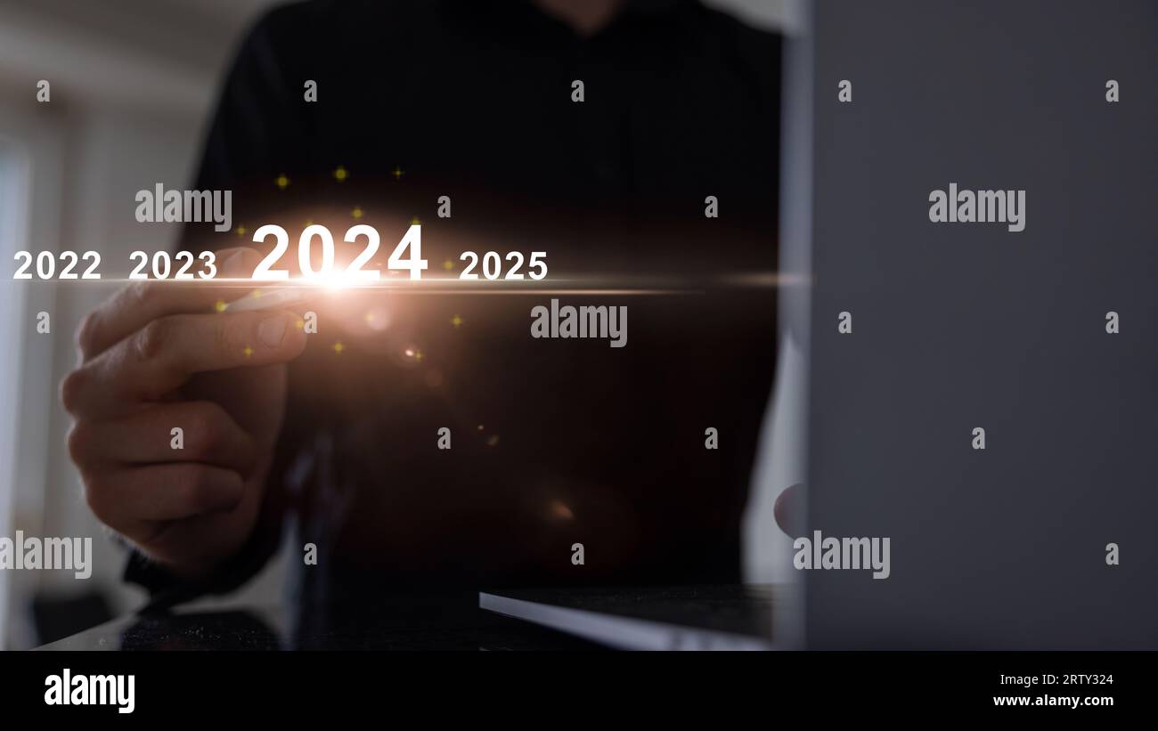Man touching on virtual screen start button for 2024 New Year, Start ...