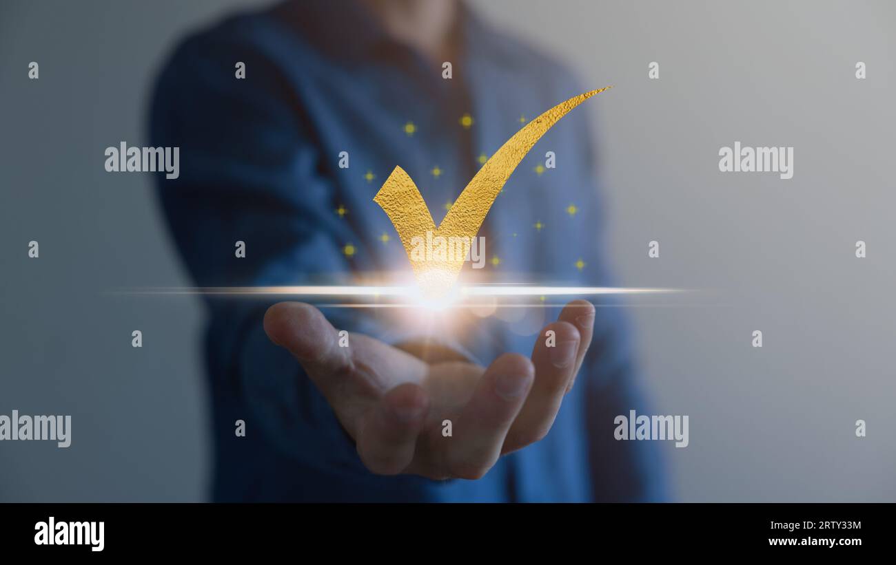 Businessman hand showing gold check mark digital technology icon symbol ...