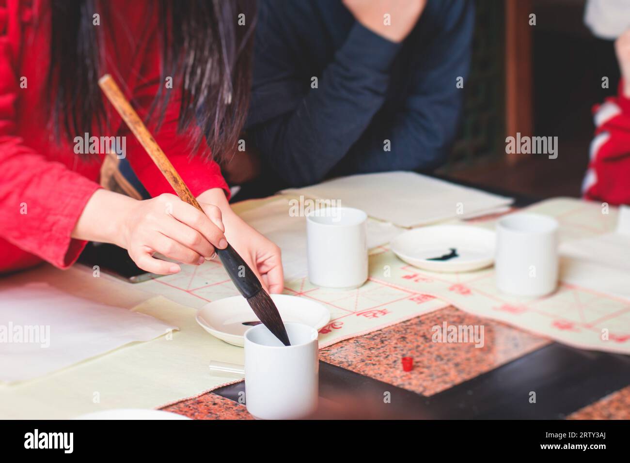 Chinese calligraphy lesson, group of kids learn and practicing ...