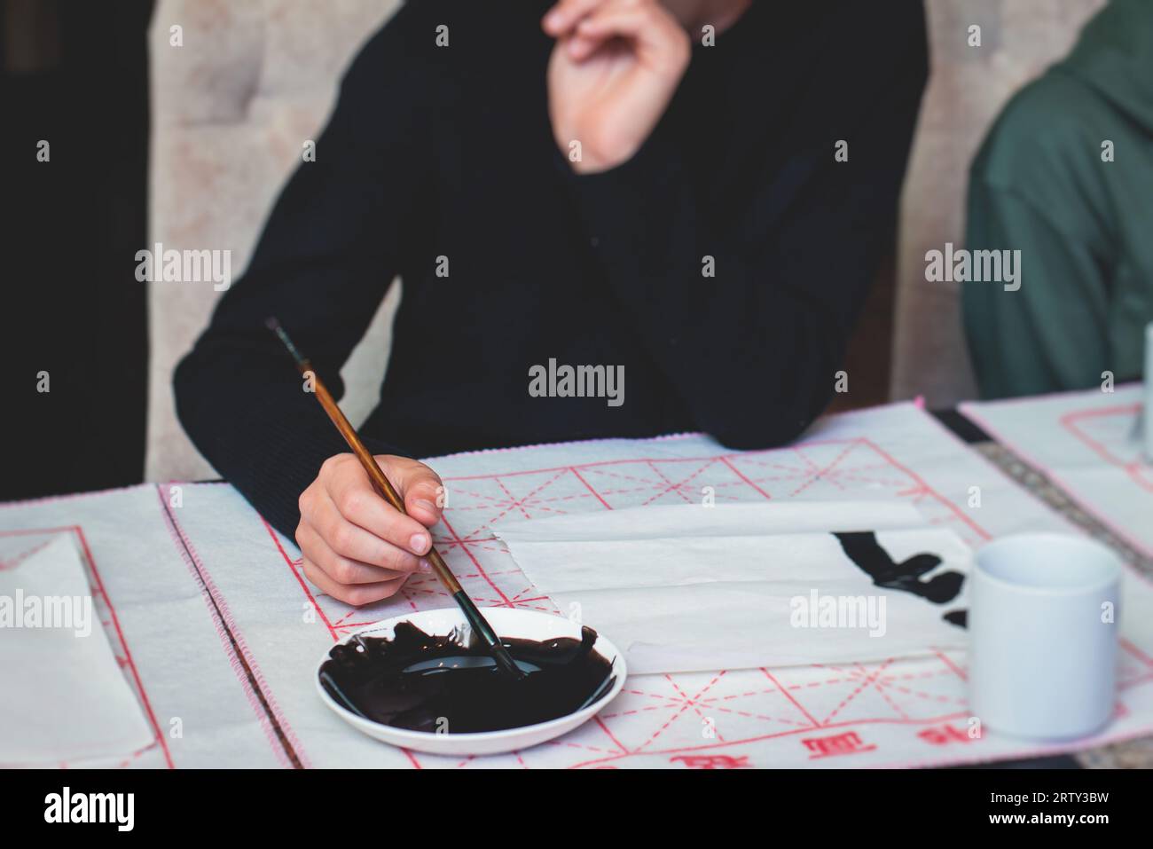 Chinese calligraphy lesson, group of kids learn and practicing ...