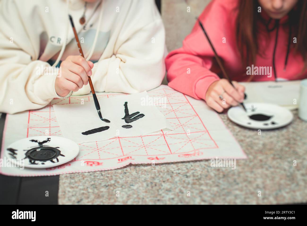 Chinese calligraphy lesson, group of kids learn and practicing ...