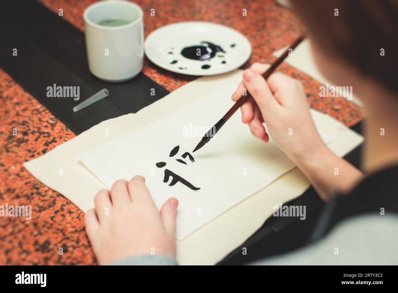 Chinese calligraphy lesson, group of kids learn and practicing ...