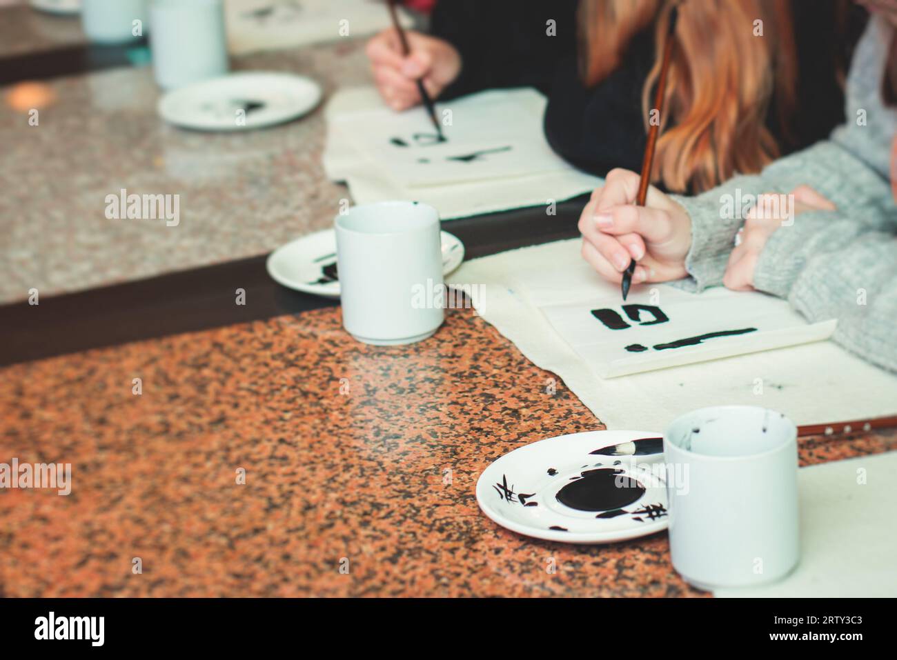 Chinese calligraphy lesson, group of kids learn and practicing ...