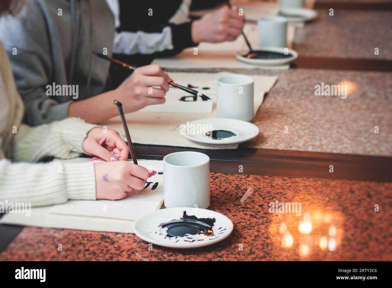 Chinese calligraphy lesson, group of kids learn and practicing ...