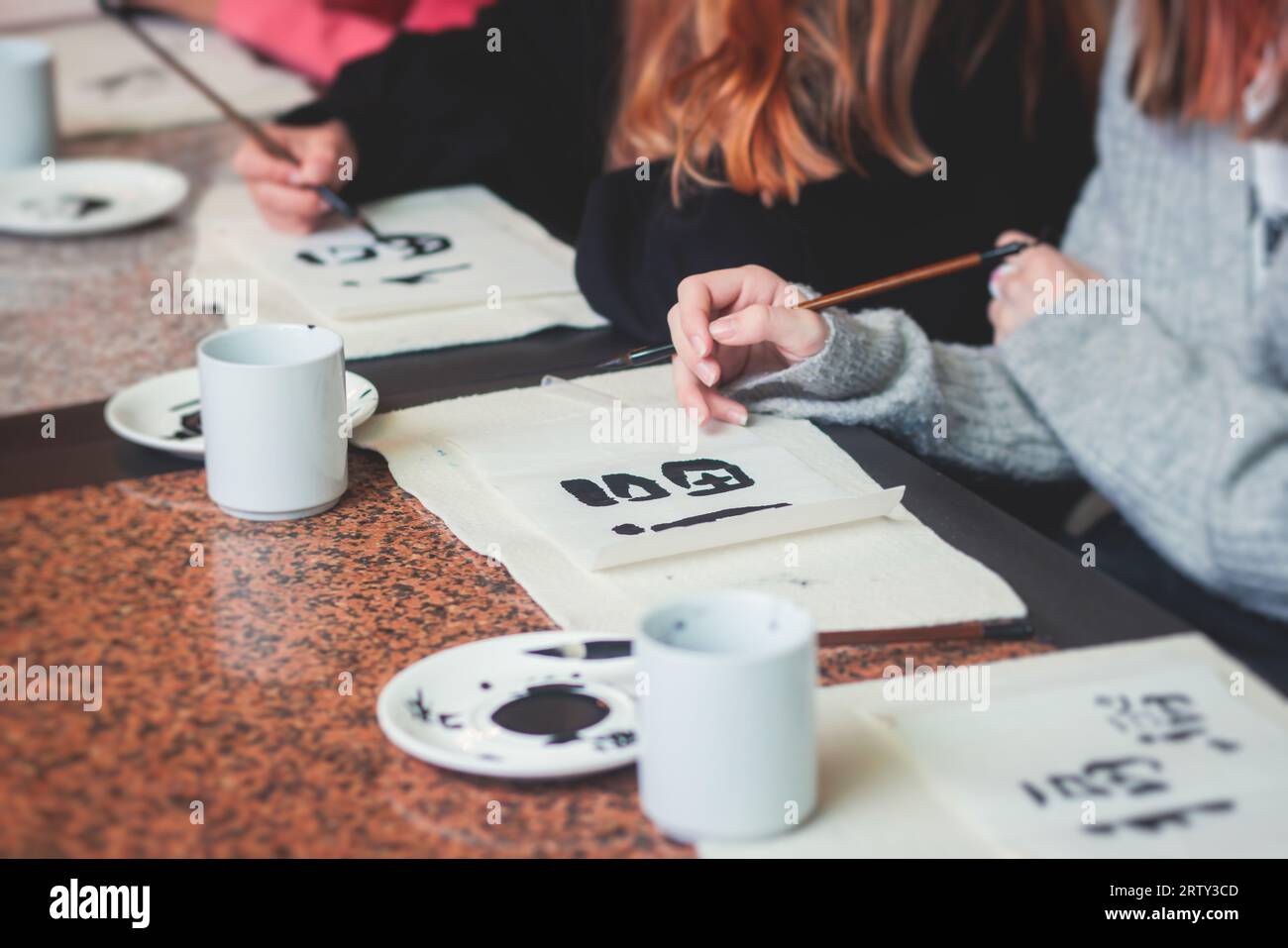 Chinese calligraphy lesson, group of kids learn and practicing ...