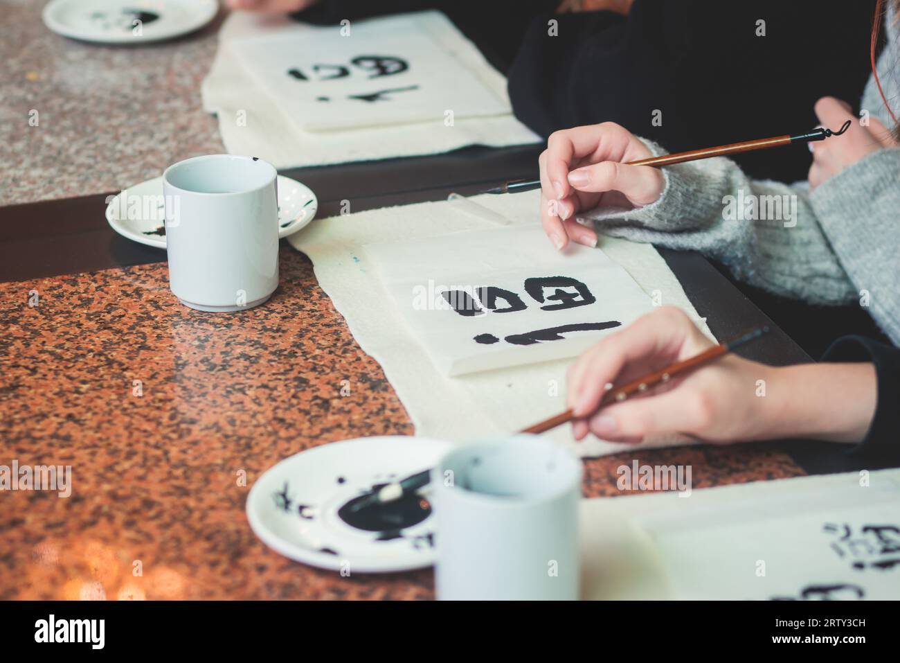 Chinese calligraphy lesson, group of kids learn and practicing ...