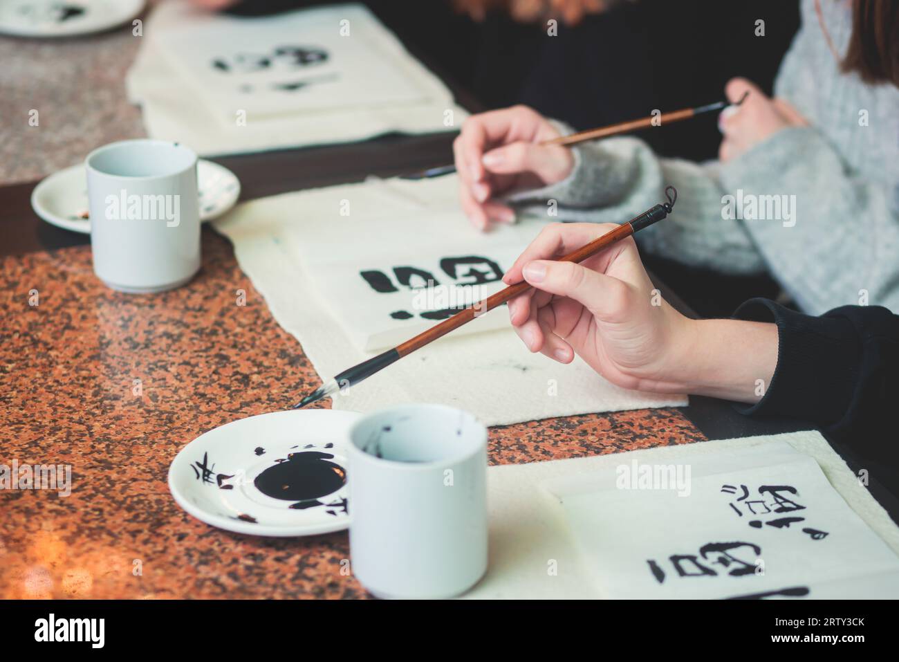 Chinese calligraphy lesson, group of kids learn and practicing ...