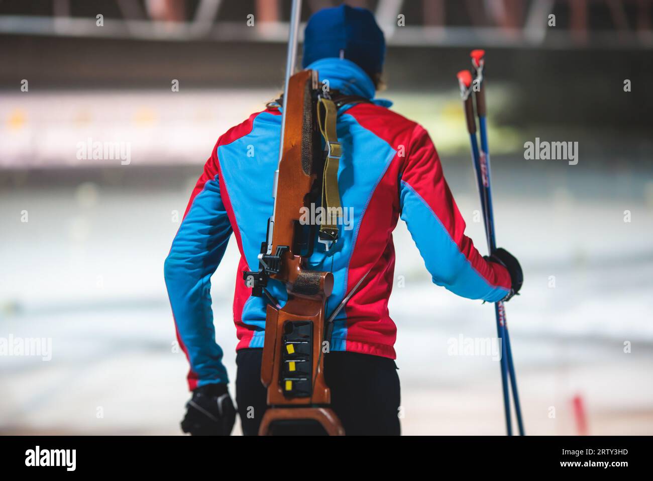 Biathlete with rifle on a shooting range during biathlon training ...