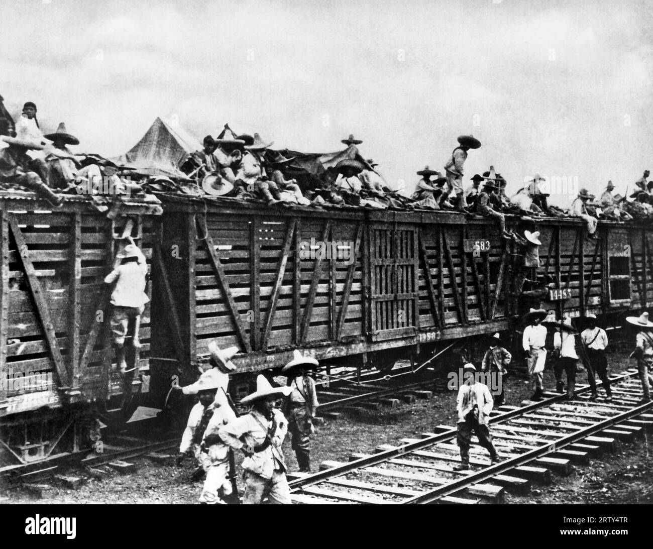 Mexico. c. 1913 Rebel soldiers on board a train in Mexico. The main ...