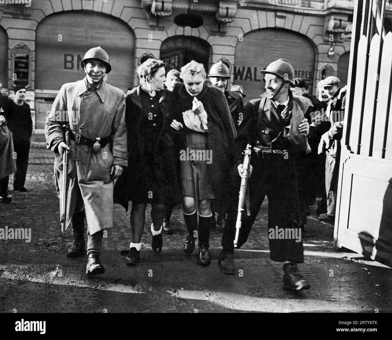 Belfort, France: c. 1945 Two women accused of collaboratoring with the ...