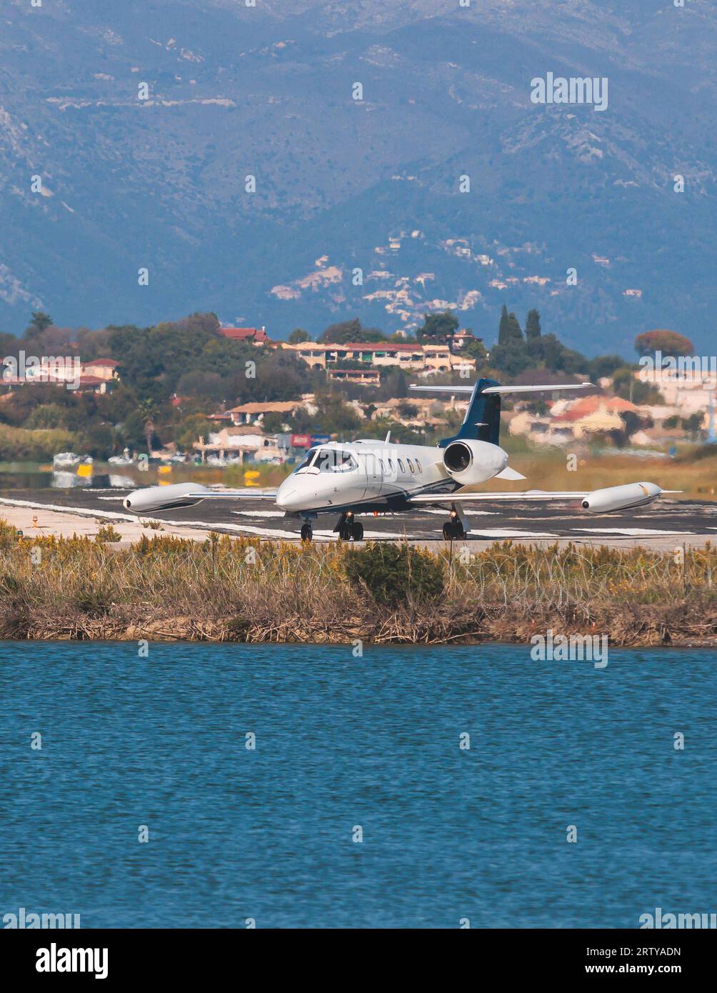 View of modern private reactive aircraft on an runway airfield ready to ...