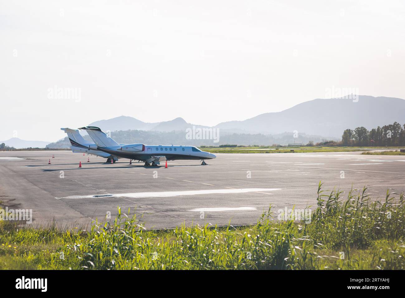 View of modern private reactive aircraft on an runway airfield ready to ...