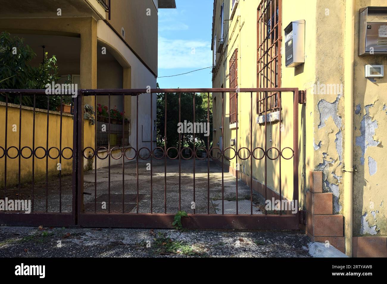 Entrance pathway between two houses in an italian village in the ...