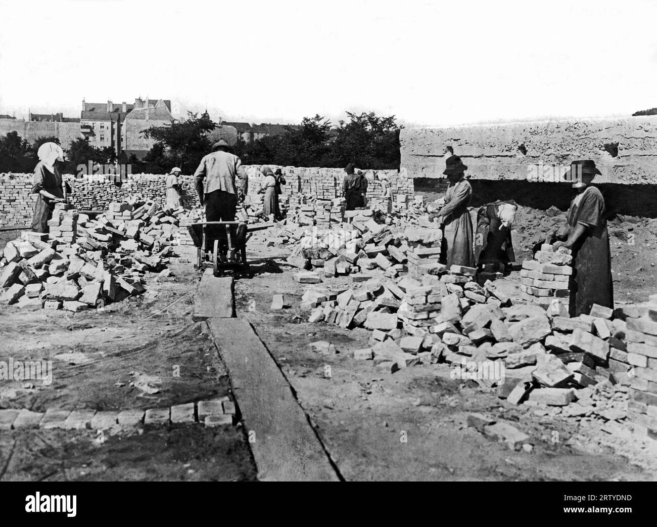 Berlin, Germany November 1, 1919 German citizens cleaning and piling up ...