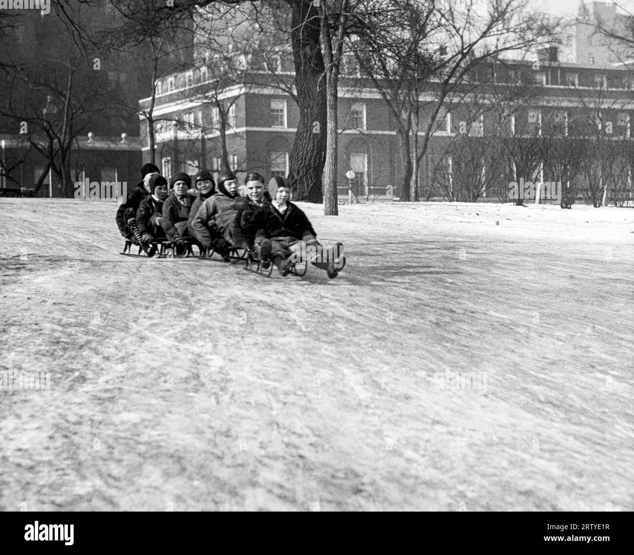 Chicago, Illinois, December 26, 1930 A bunch of youngsters on sleds all ...