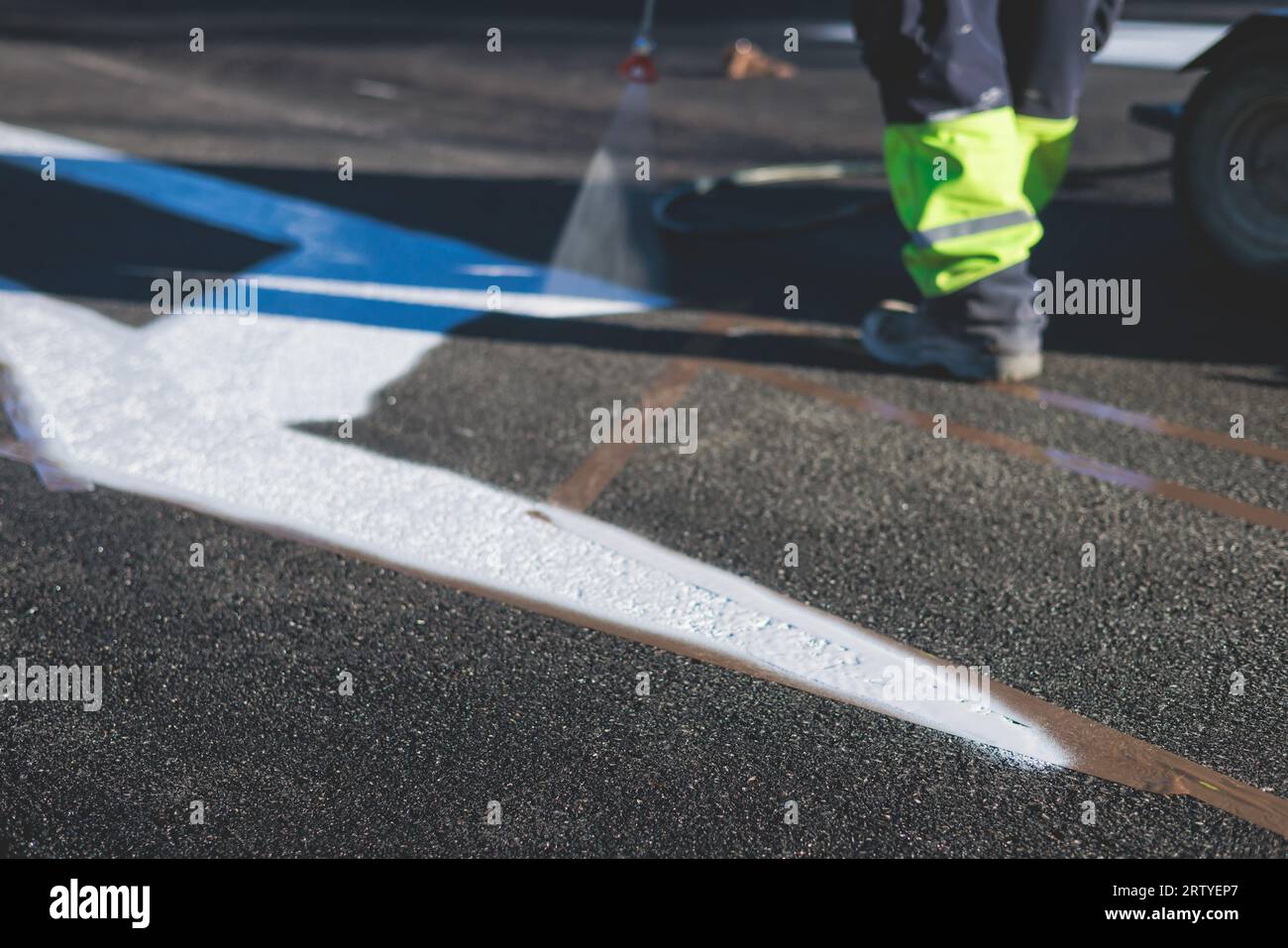 Process of making new road surface markings with a line striping ...