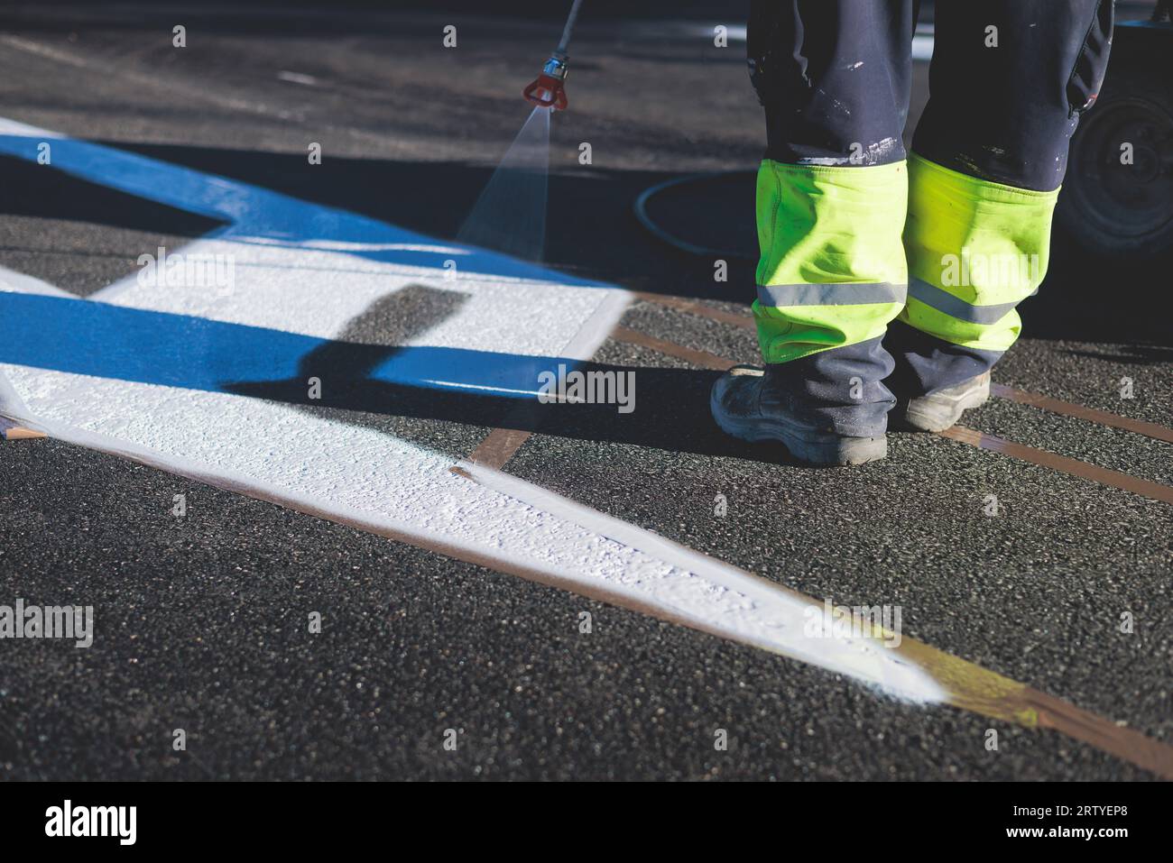 Process of making new road surface markings with a line striping ...