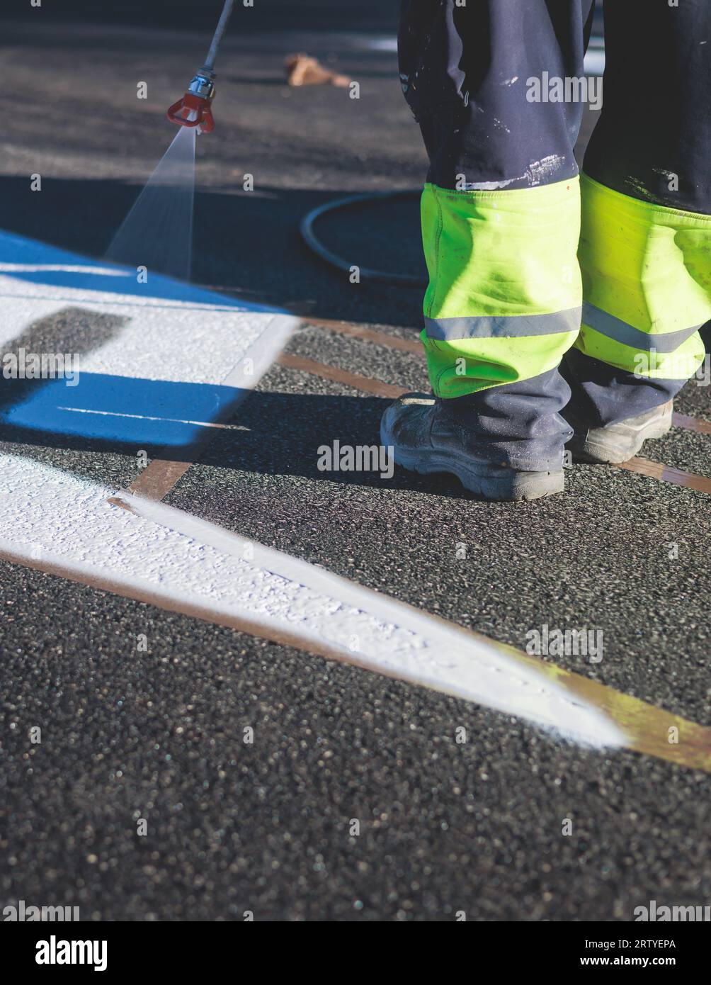 Process of making new road surface markings with a line striping ...