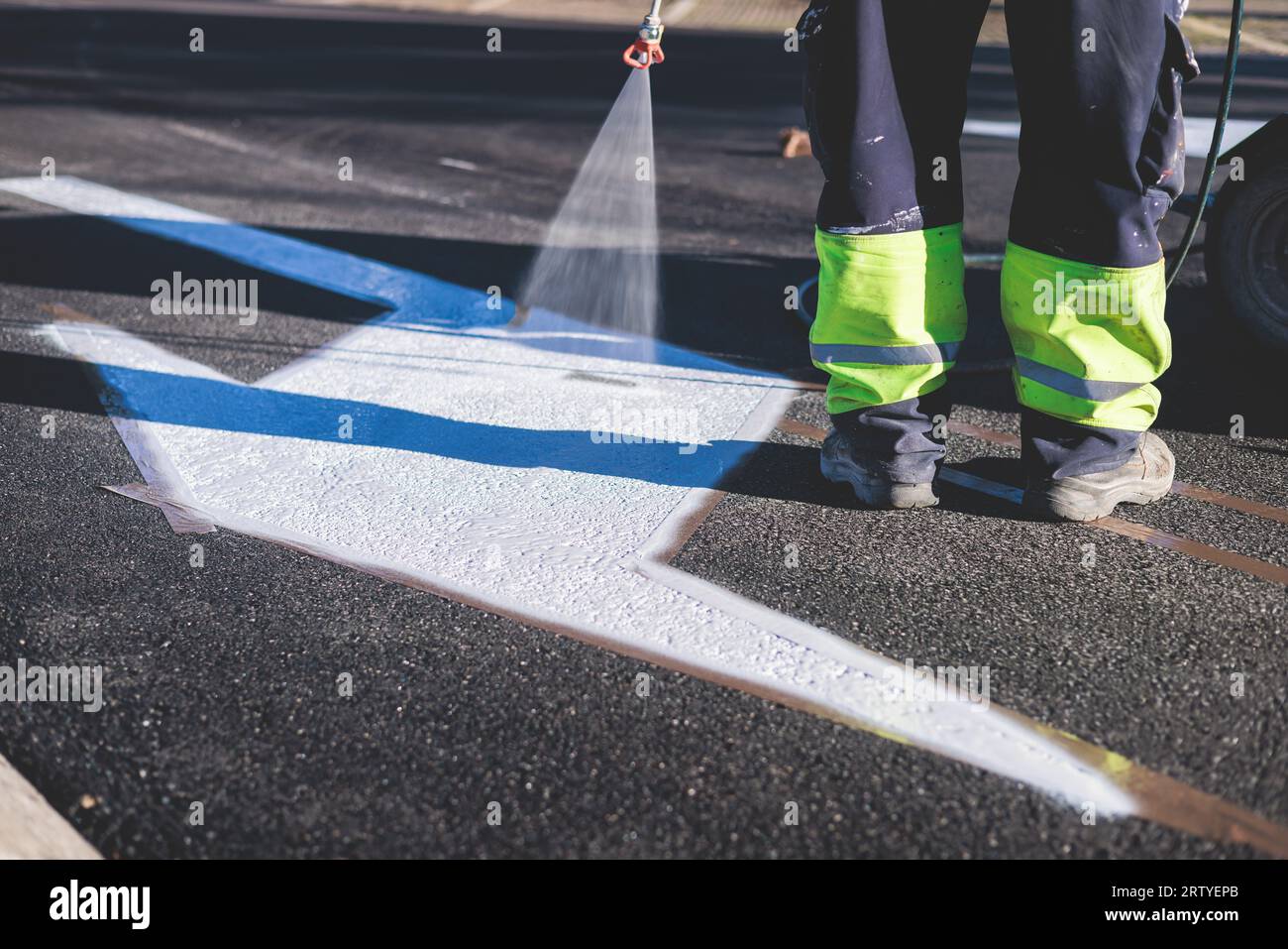 Process of making new road surface markings with a line striping ...