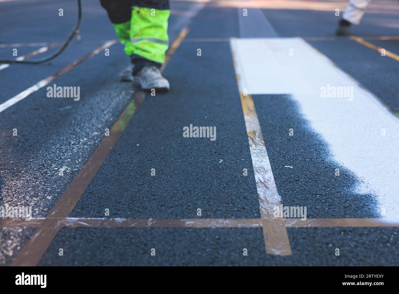 Process of making new road surface markings with a line striping ...