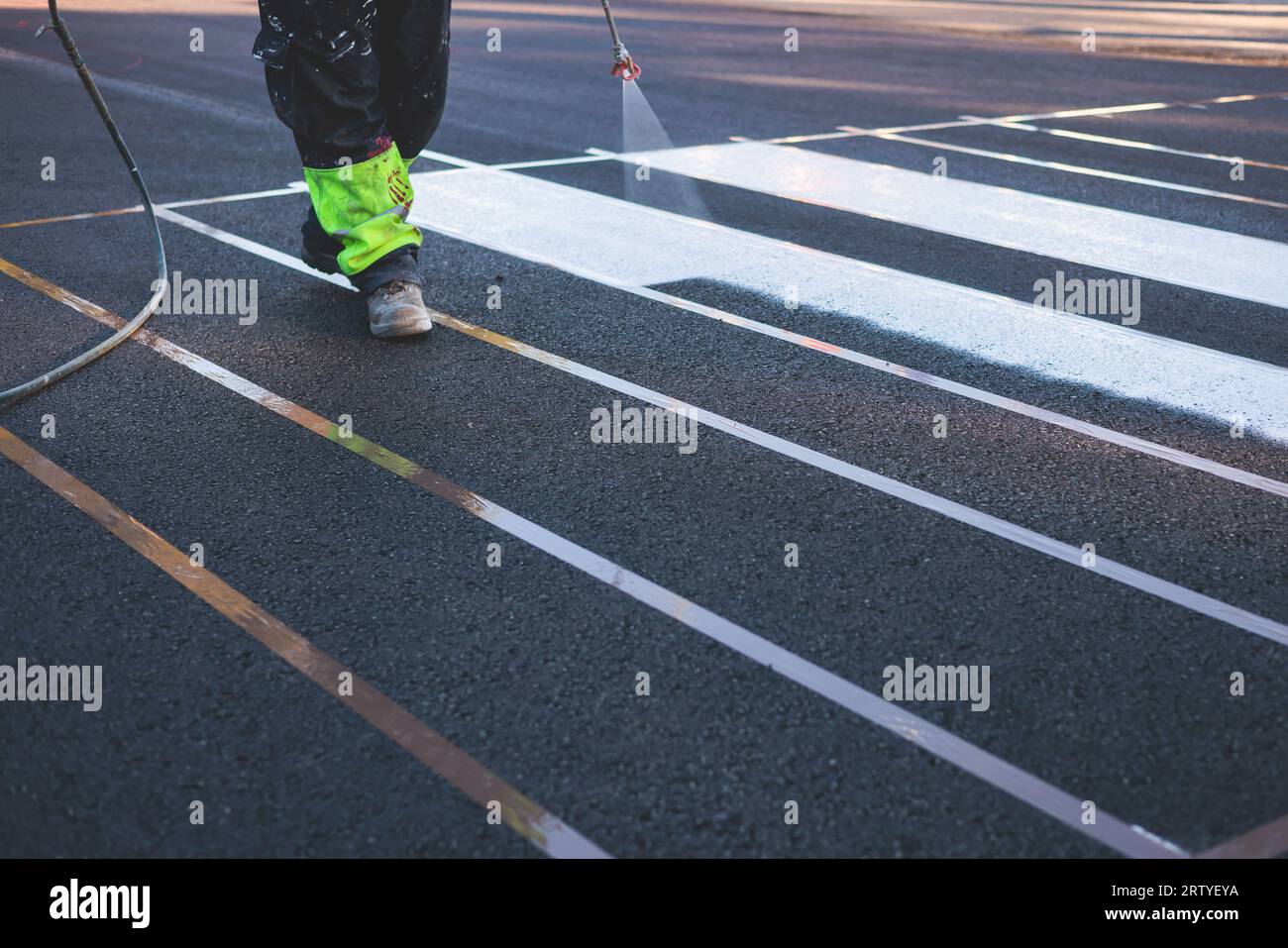 Process of making new road surface markings with a line striping ...
