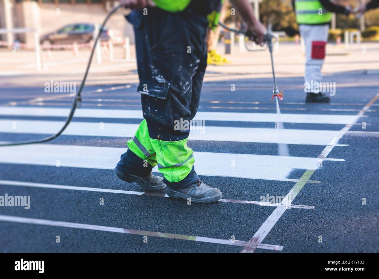 Process of making new road surface markings with a line striping ...