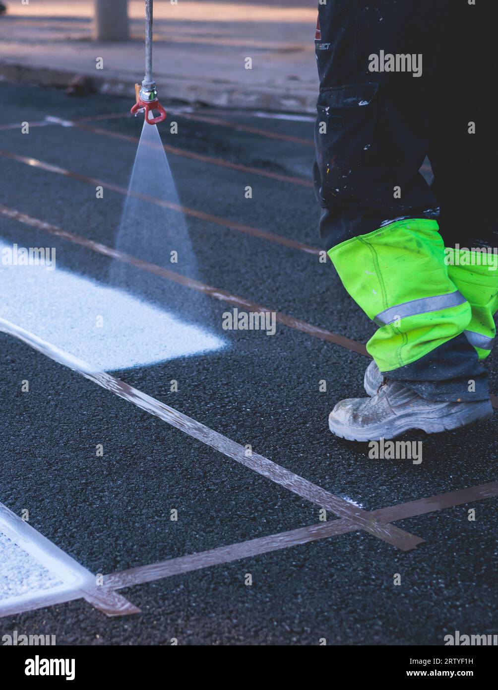 Process of making new road surface markings with a line striping ...