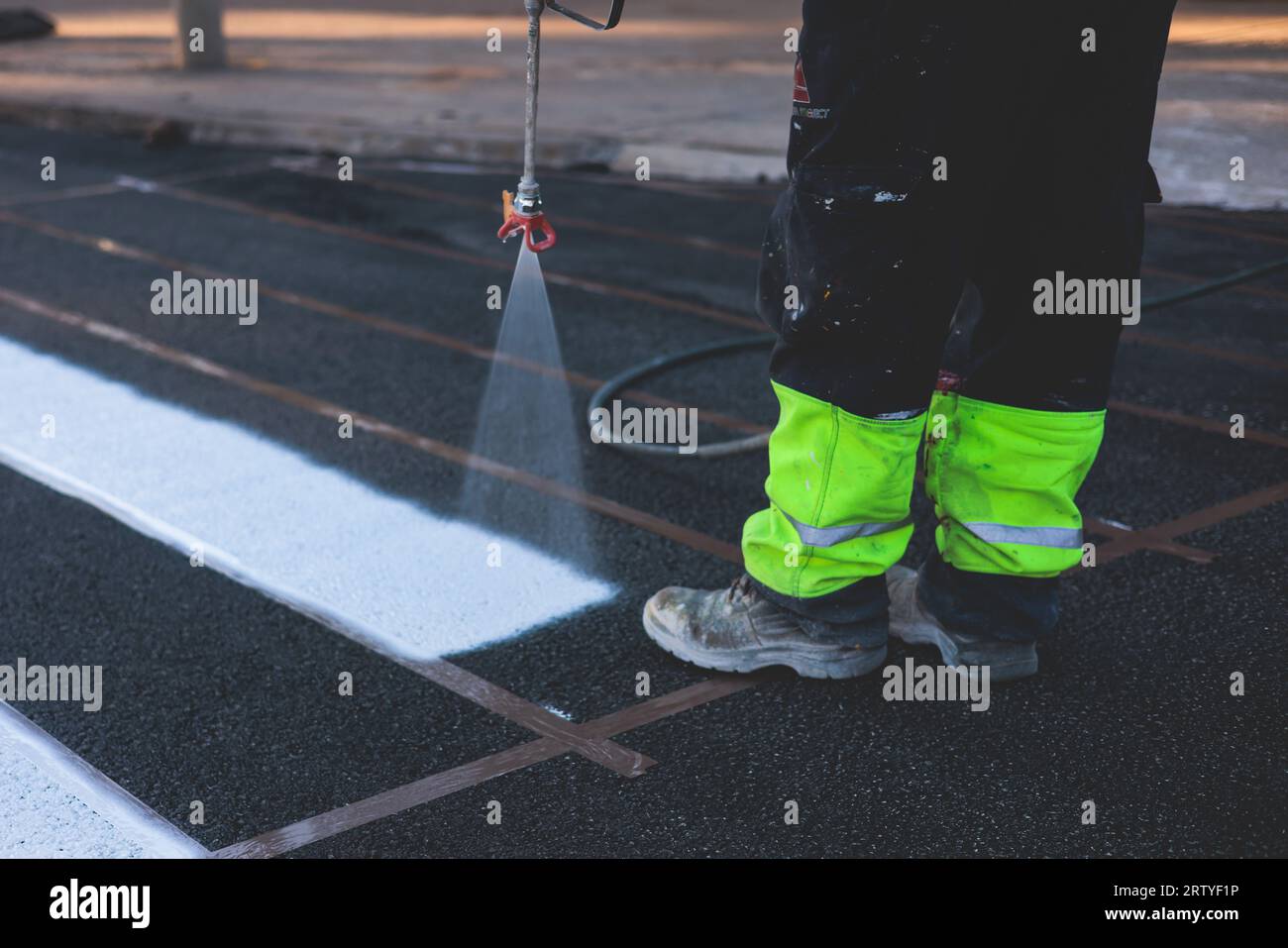 Process of making new road surface markings with a line striping ...