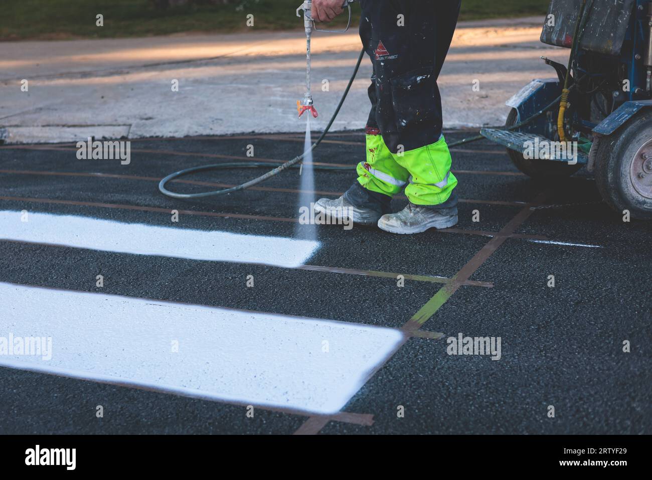 Process of making new road surface markings with a line striping ...
