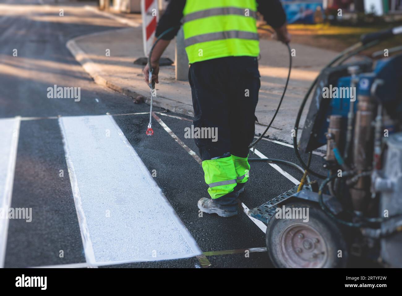Process of making new road surface markings with a line striping ...