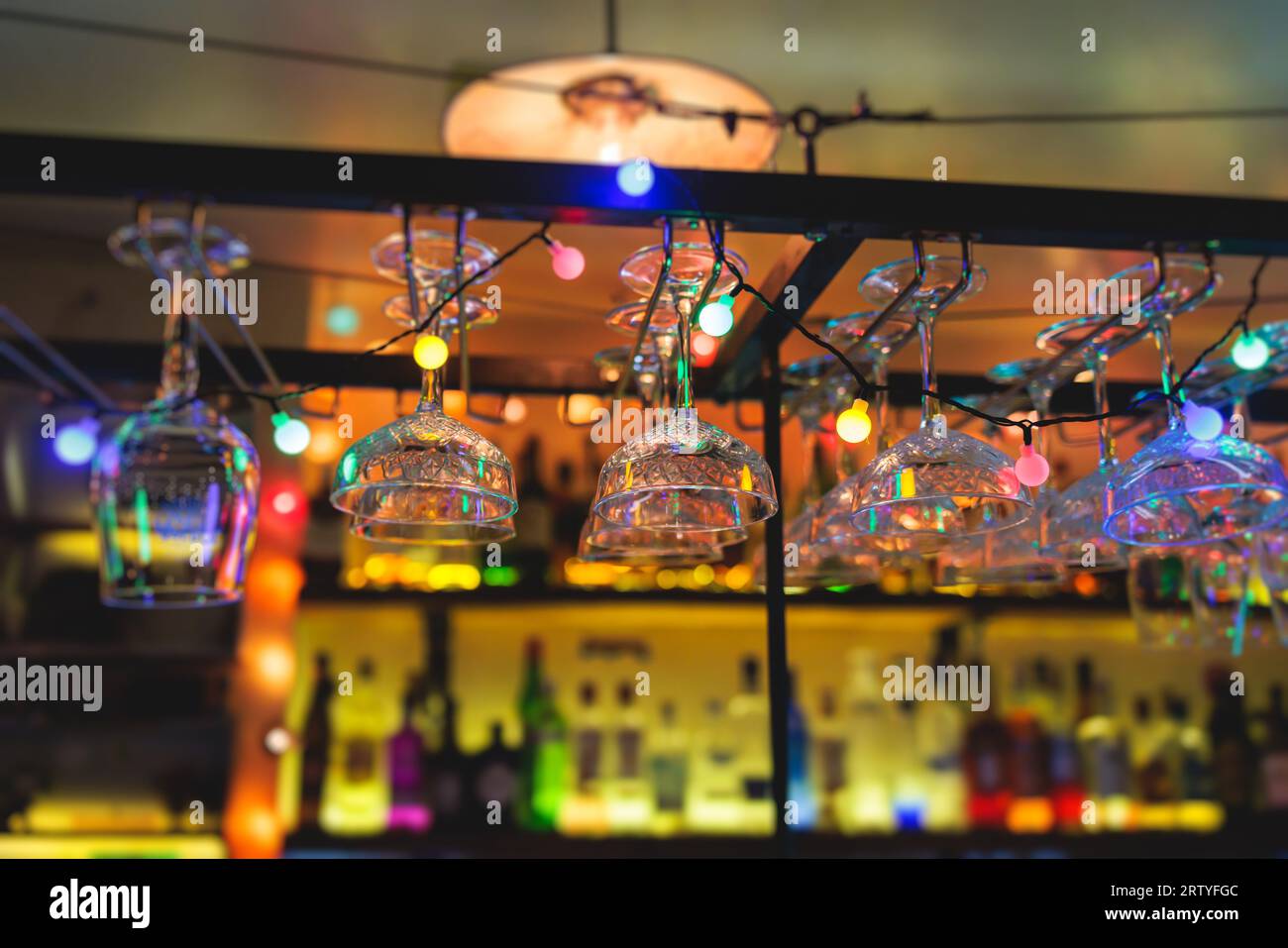 Bar interior details, glasses for wine and different alcohol cocktail ...