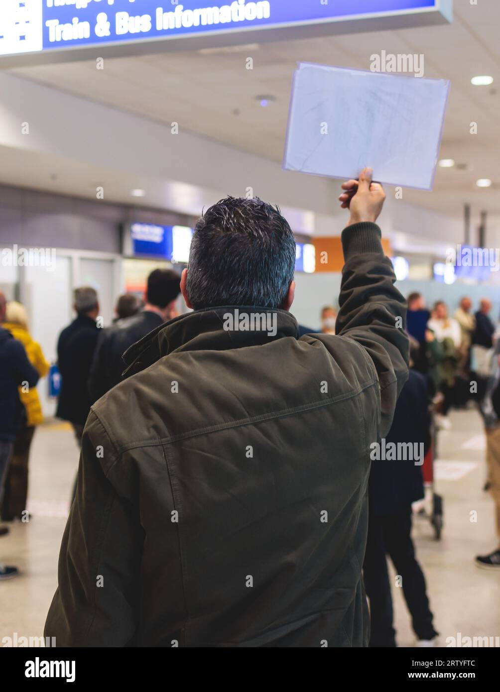 Meeting at the airport, person holding a placard card sign with welcome ...