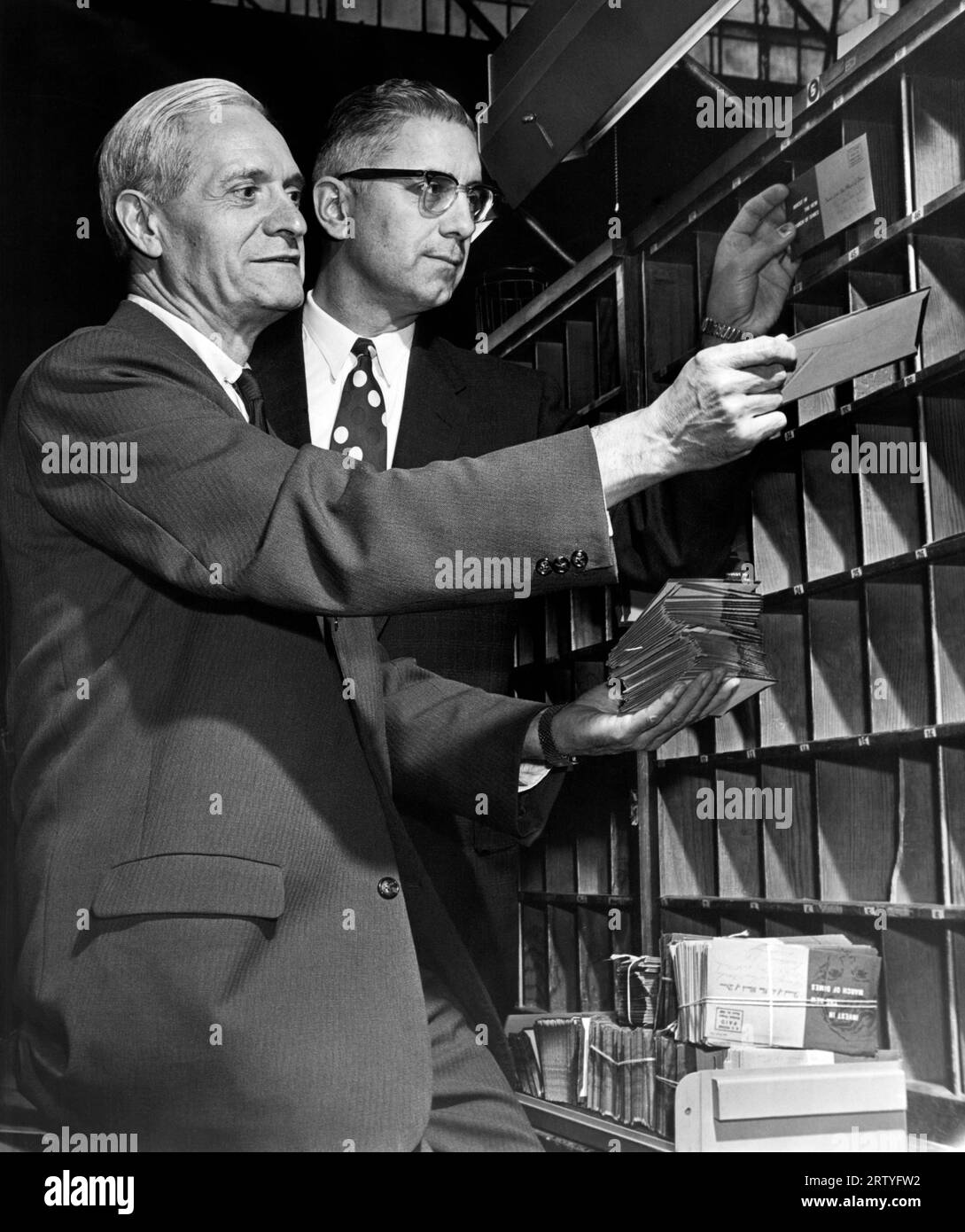 Portland, Oregon: December 29, 1960. Two men are putting March of Dimes ...