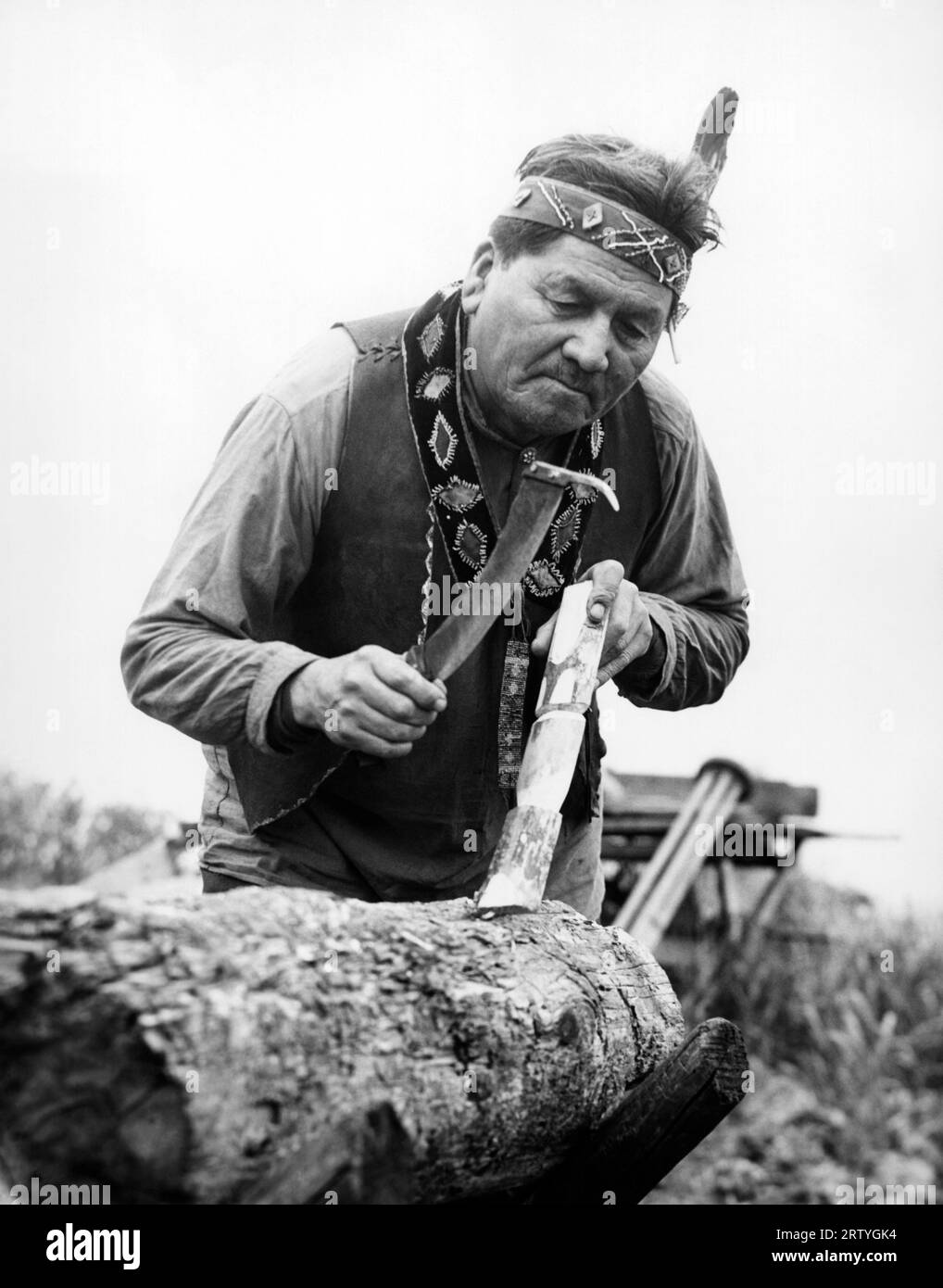 Washington: 1946. A Northwest Native American begins a totem pole from ...