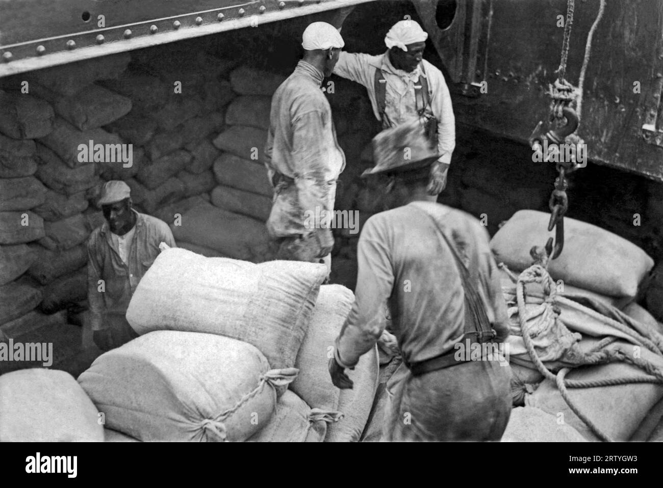 New York, New York c. 1922 African American men working on the New York docks loading freighters ...