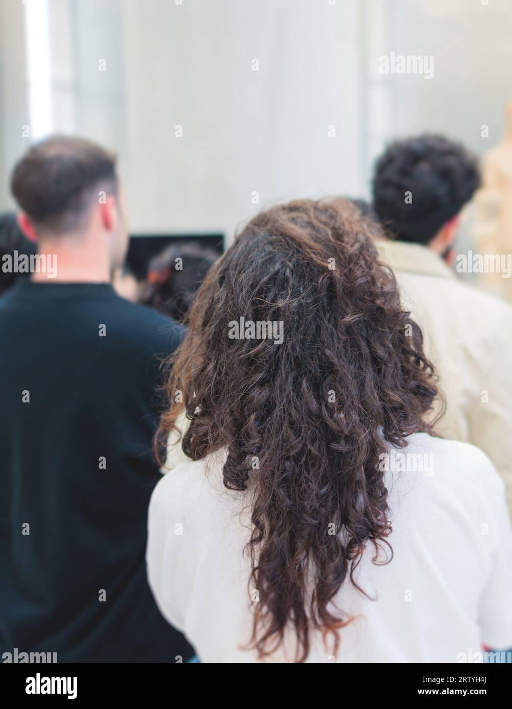 Group of students on excursion visit gallery museum with tour guide, a ...