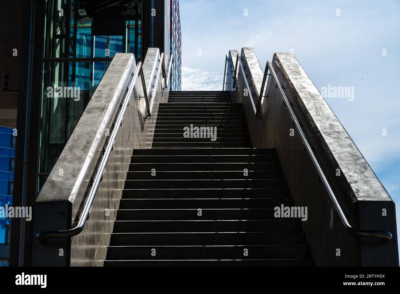 Tall concrete stairs in sunshine Stock Photo - Alamy