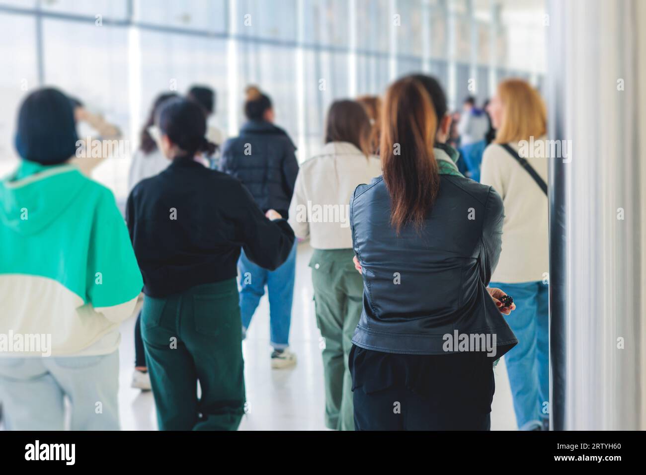 Group of students on excursion visit gallery museum with tour guide, a ...